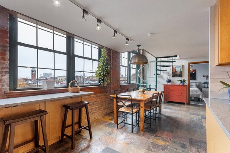 On the Market: A Greenhouse-Like Loft in a Converted Mill Building